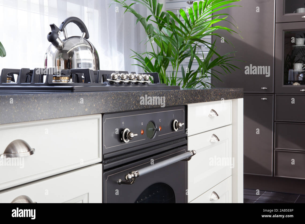 Modern electric oven built into the kitchen Stock Photo - Alamy