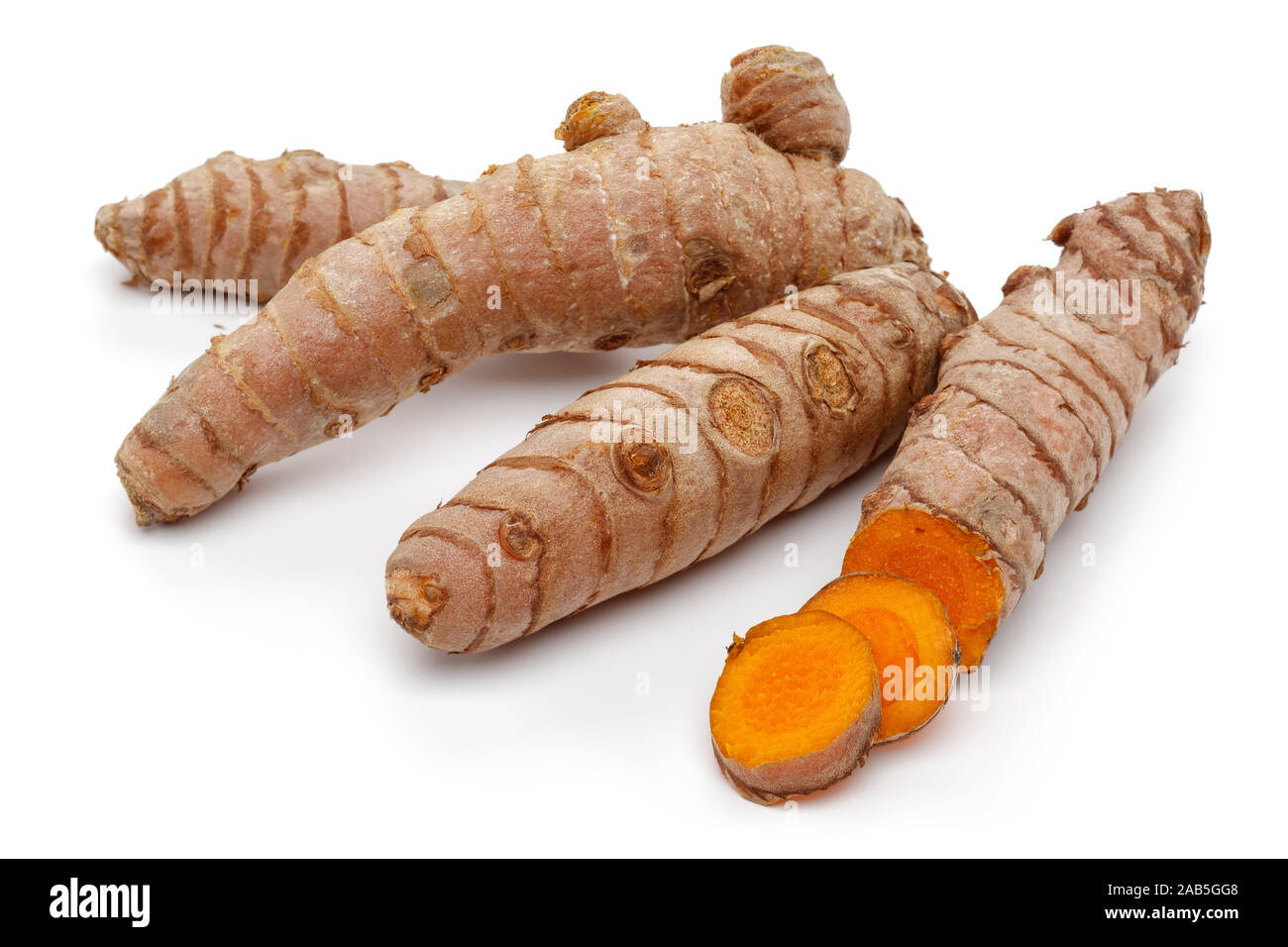 Fresh turmeric with slices isolated on white background Stock Photo - Alamy