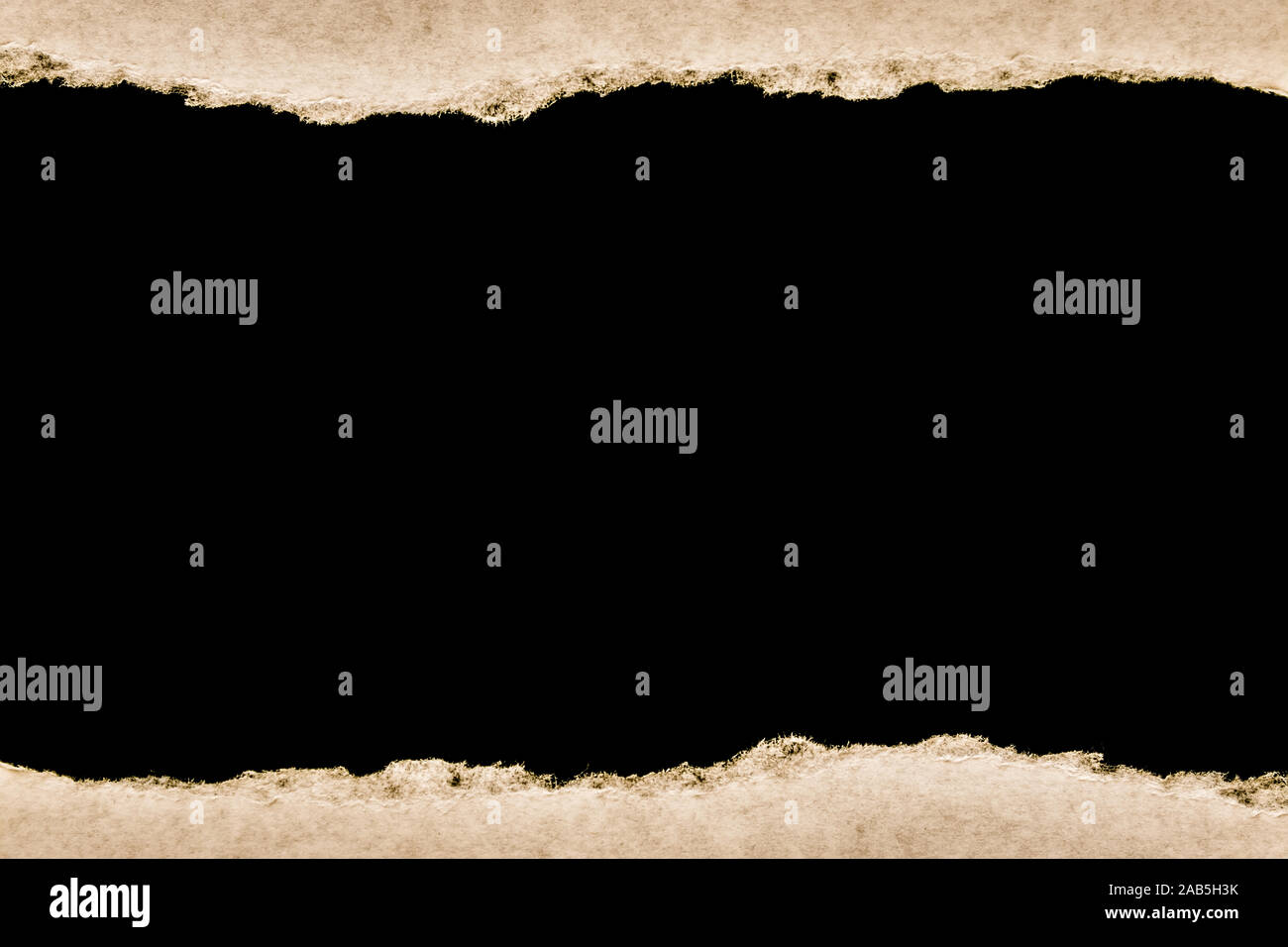 Old vintage paper with torn edges and a black isolated background ...