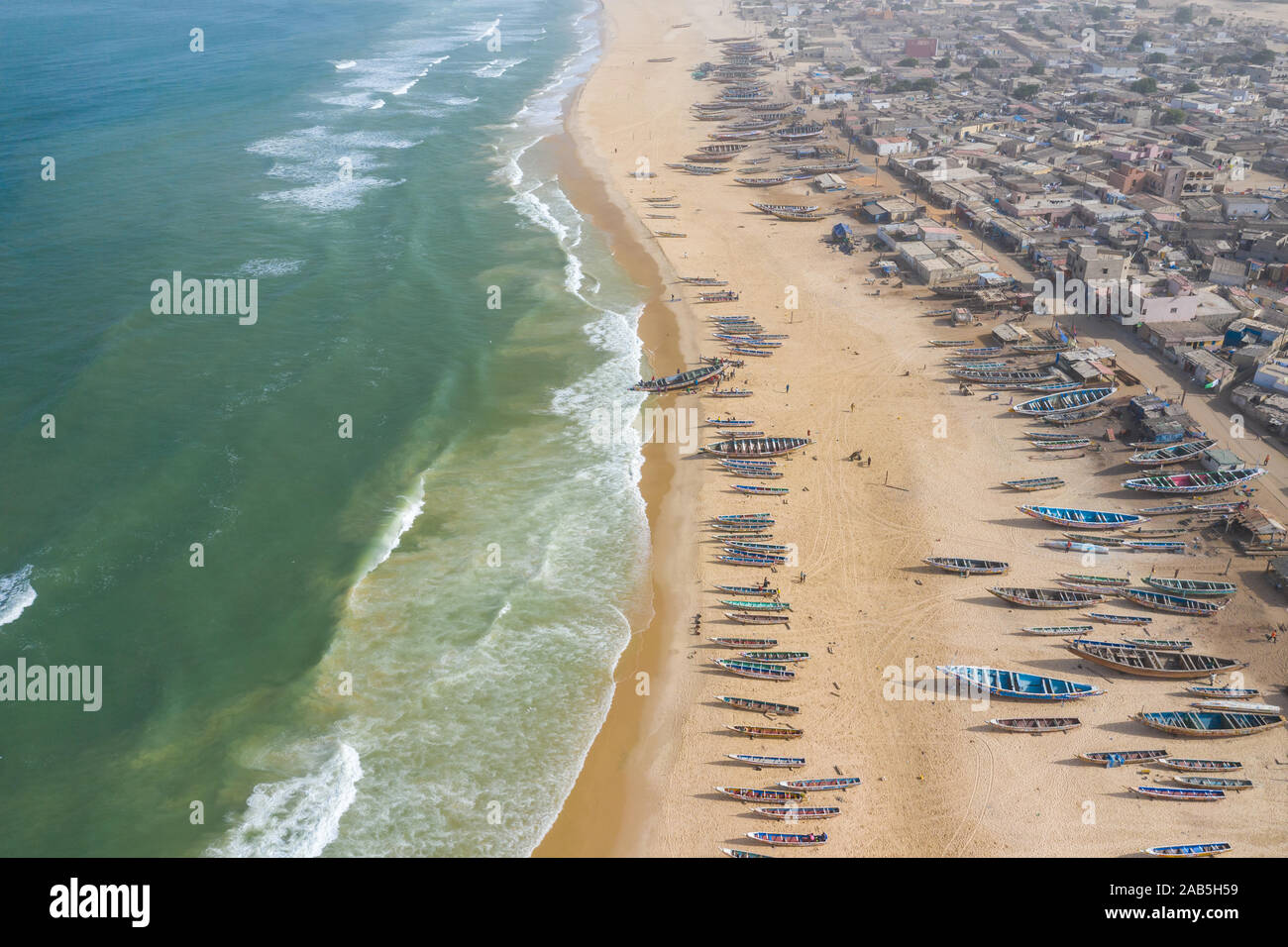 Aerial view of fishing village, pirogues fishing boats in Kayar ...