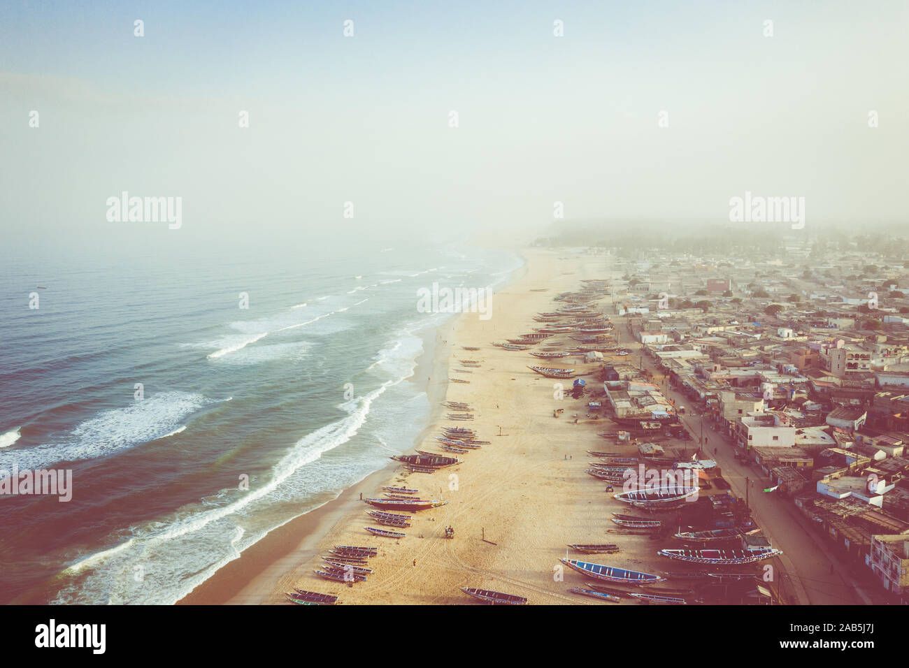 Aerial view of fishing village, pirogues fishing boats in Kayar ...
