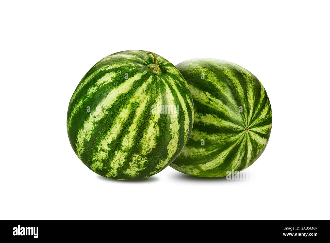 Two green, striped watermelons isolated on white with copy space for ...