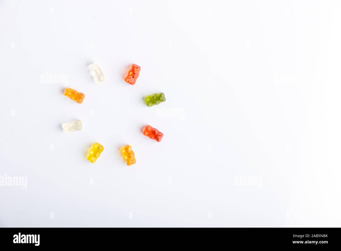 Gummy bears in circle, different colors on white background Stock Photo ...