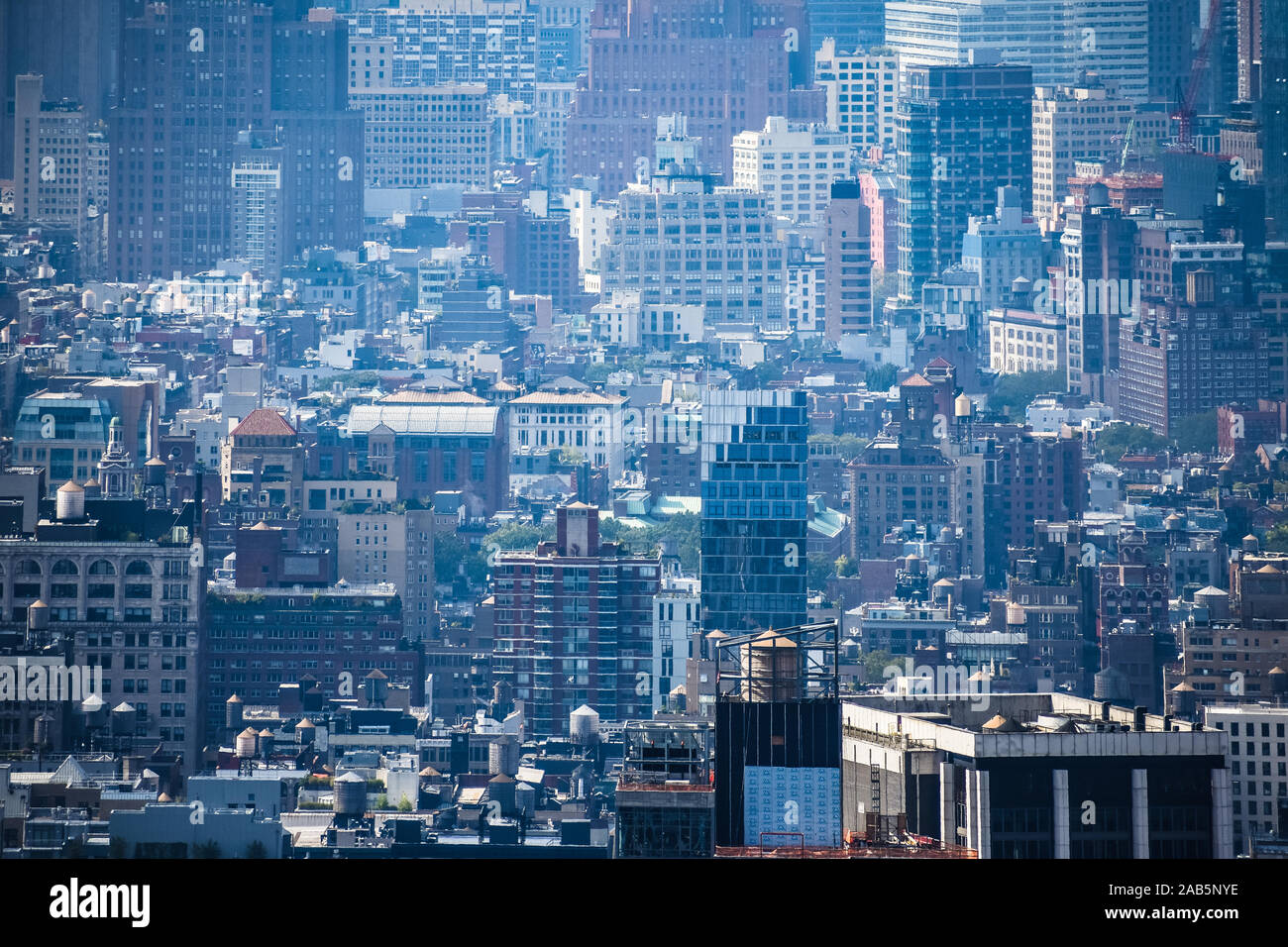 Compressed view of buildings and pollution nebula. Concept of crowded ...