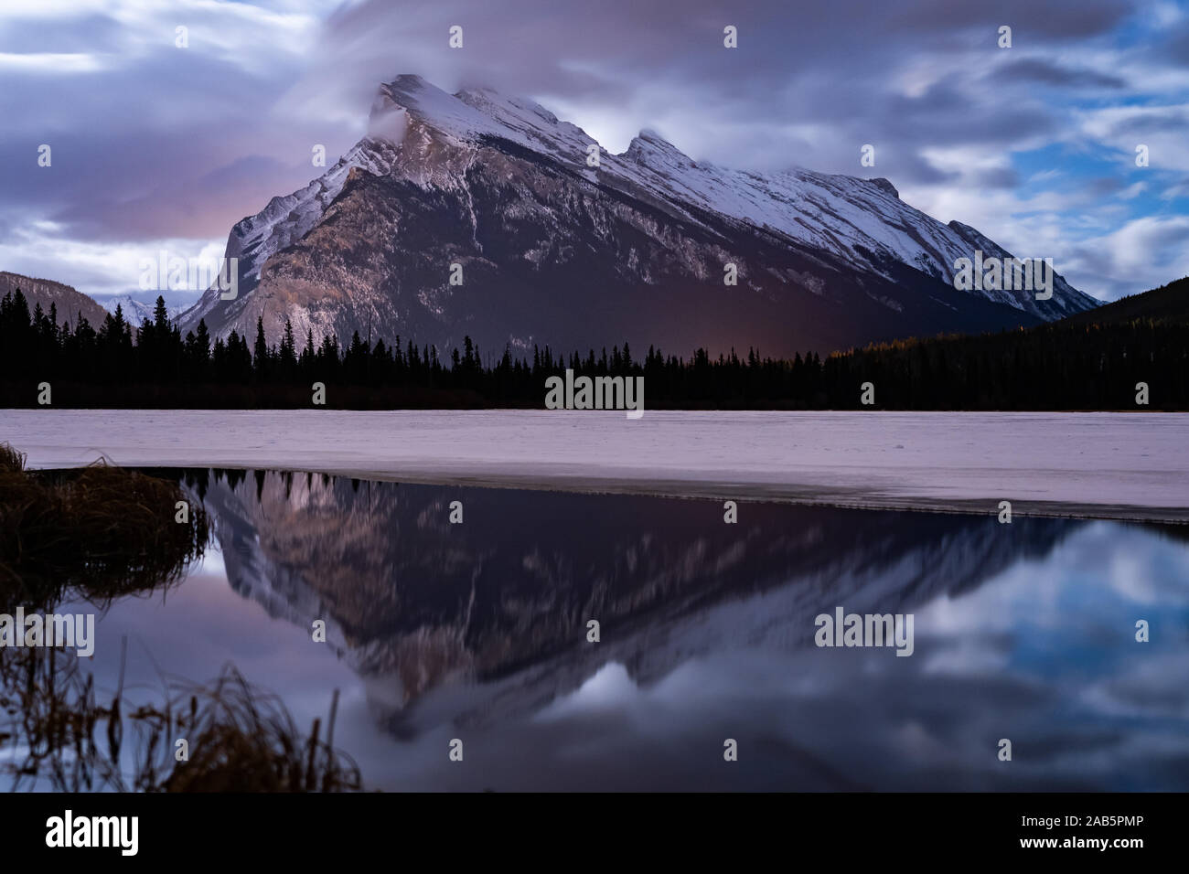 reflection photo of mt. rundle at banff national park with lake Stock ...