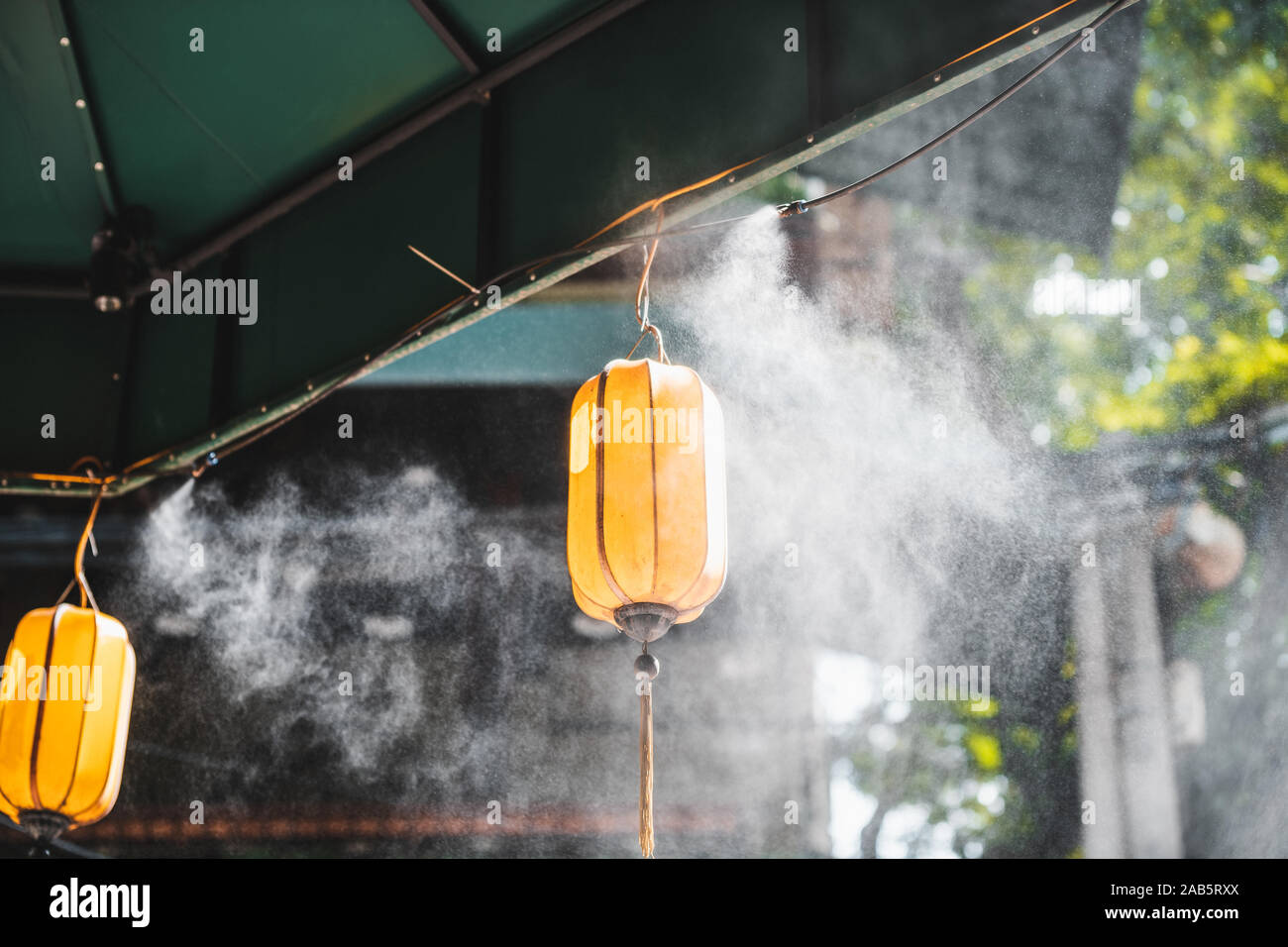 Misting System in the middle of Hanoi, Vietnam cools down people as ...