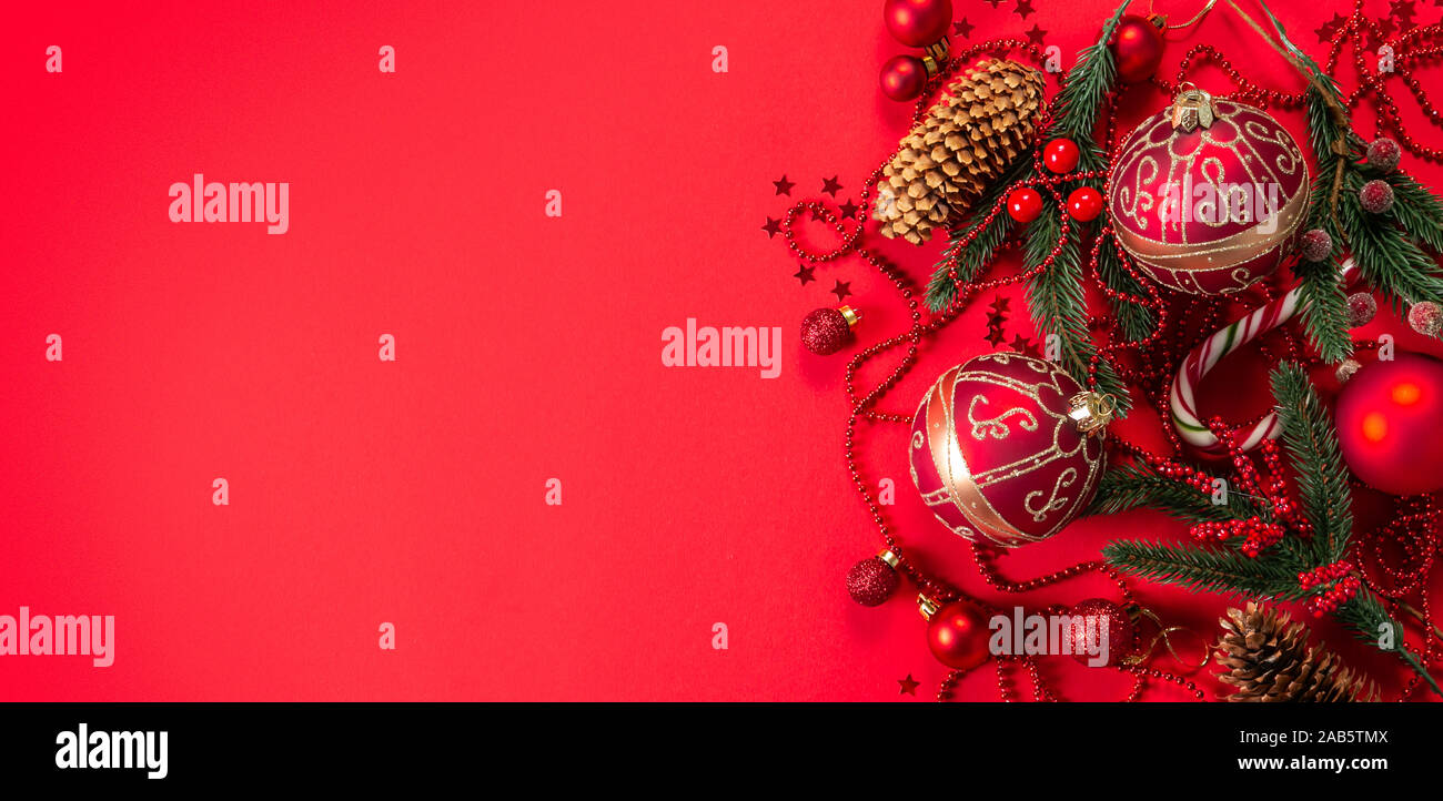 Christmas decorations on red background Stock Photo - Alamy