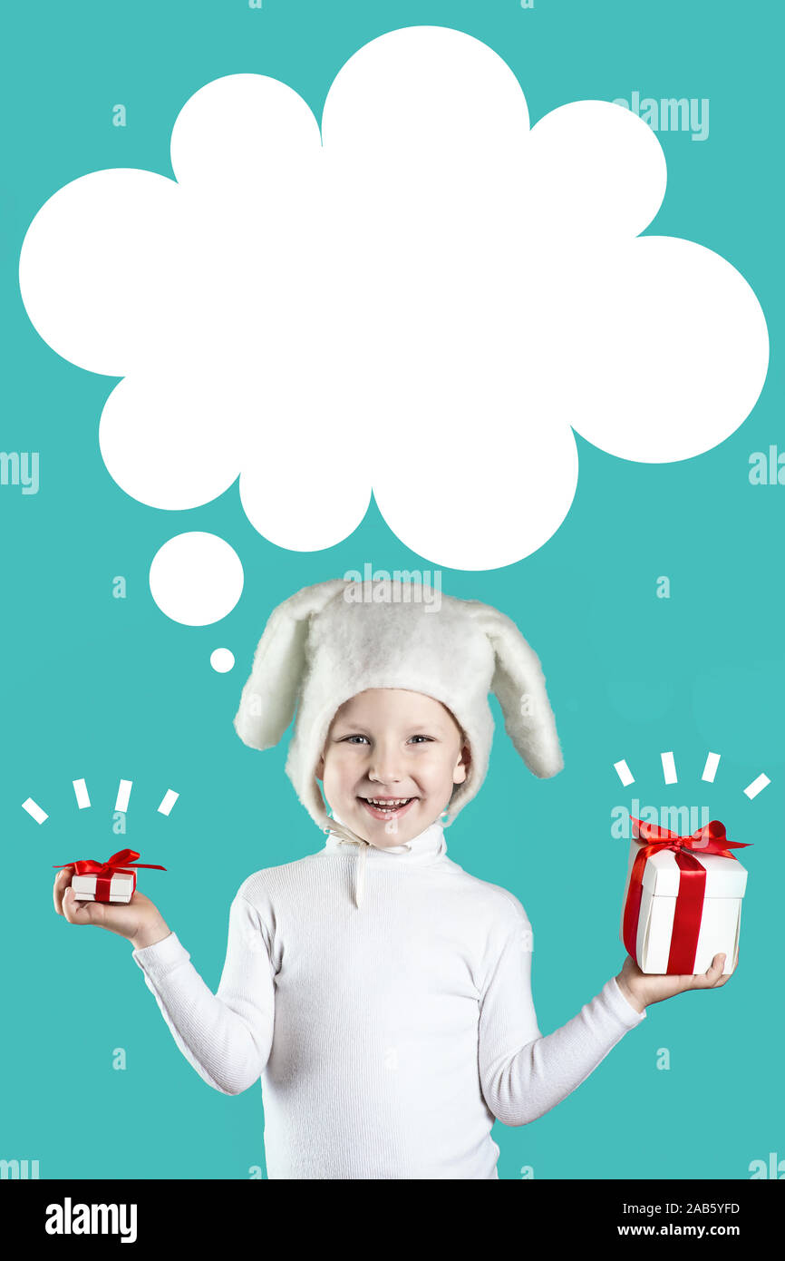 a boy dressed as a white hare tries to choose a gift on a mint ...