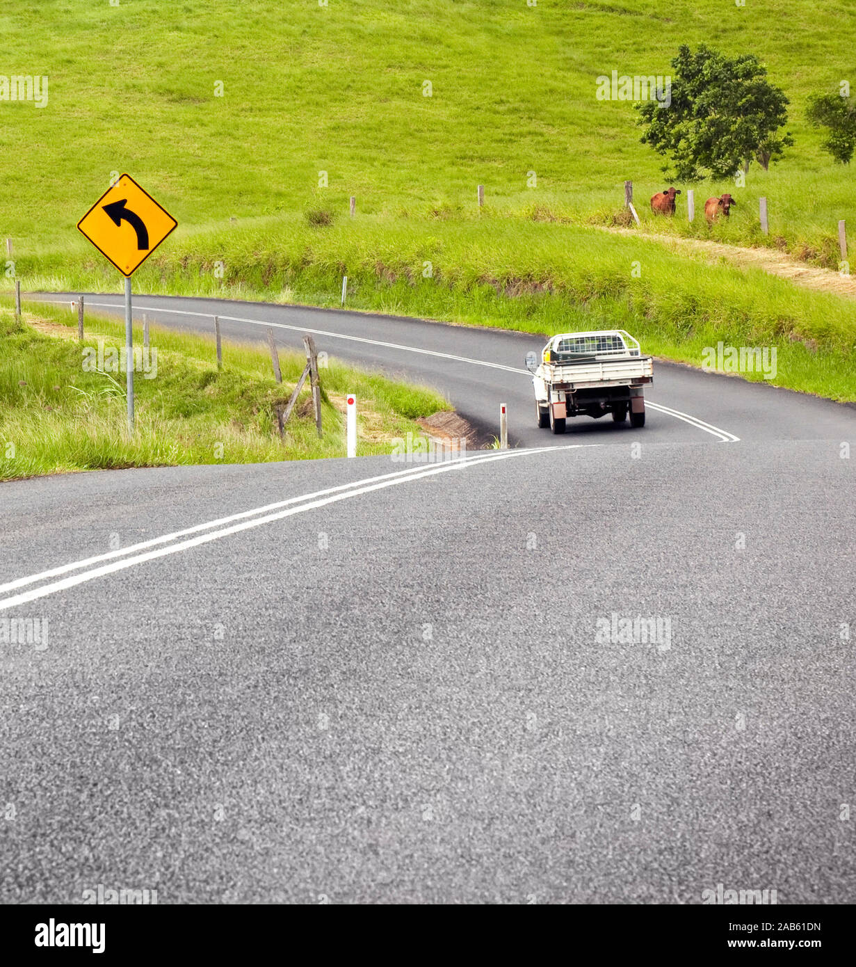 A photography of a road sign curve Stock Photo - Alamy