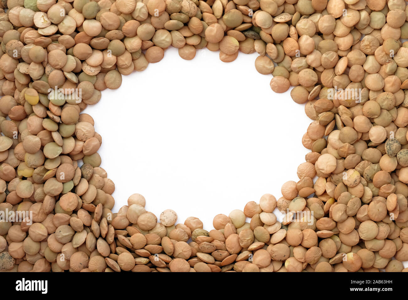 Raw green lentils background. Grains of lentils with an empty white ...