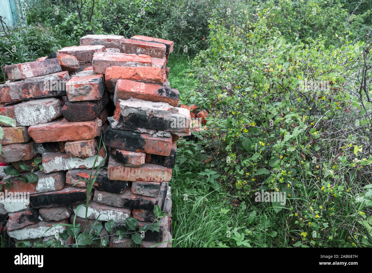 Pile of red bricks after dismantling and destruction building ...