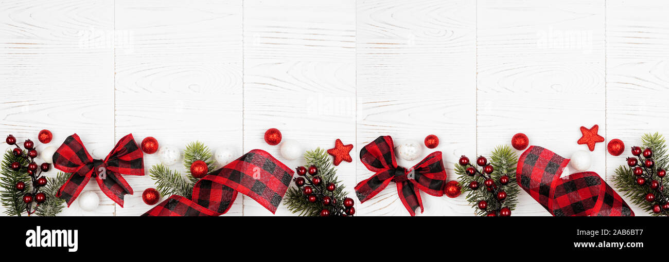 Christmas border banner of ornaments, branches and red and black ...