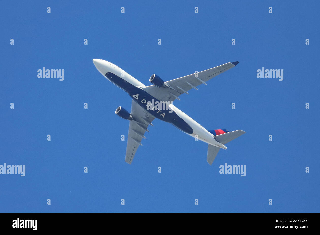 Delta Air Lines Boeing 767 passenger jet aircraft flying overhead, with ...