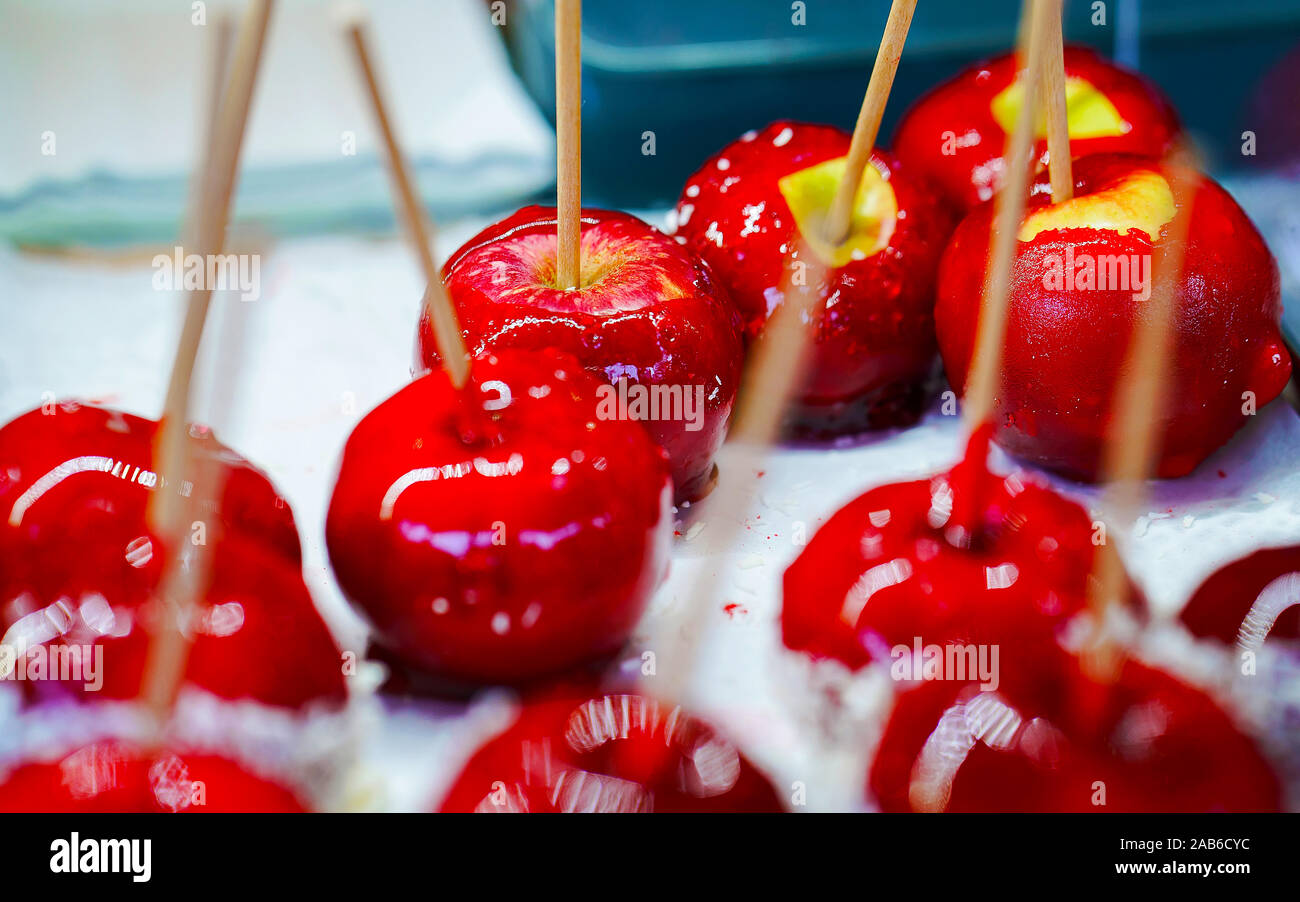 Stall with glazed lollipop apples at Christmas Market in Vilnius reflex ...