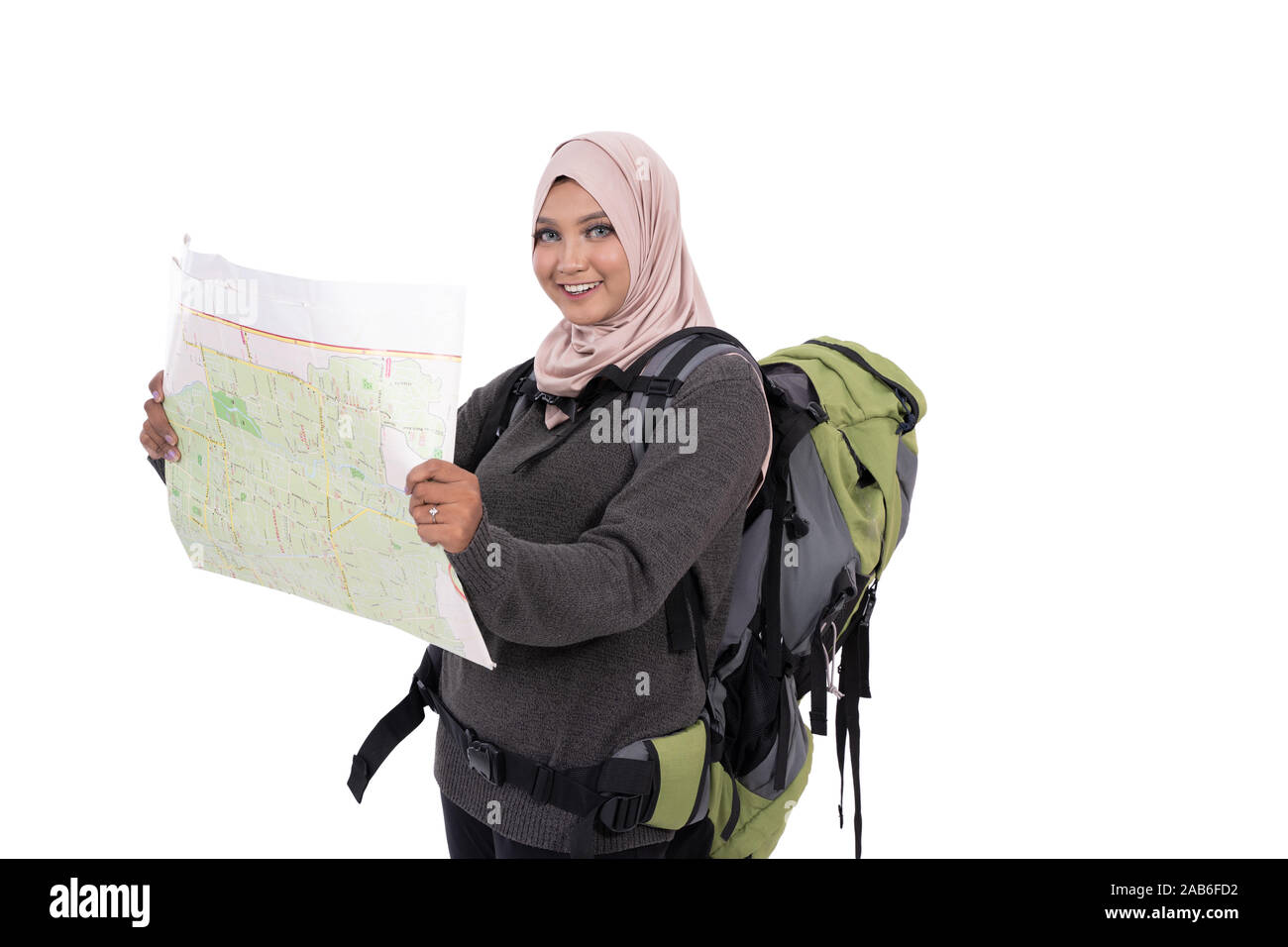 Hijab traveller holding map and looking at camera Stock Photo - Alamy