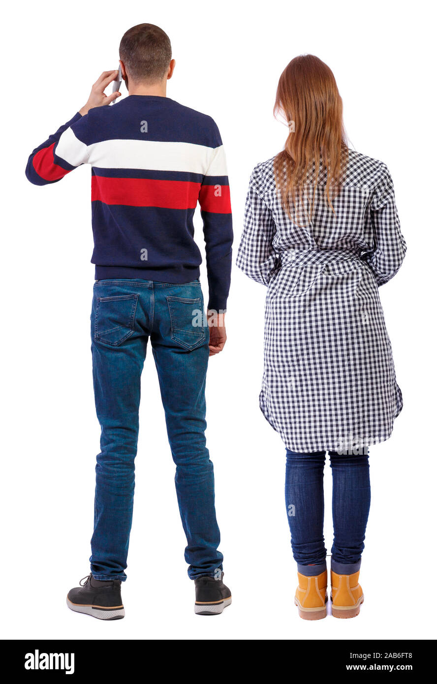 Back view of couple. beautiful friendly girl and guy together. Rear ...