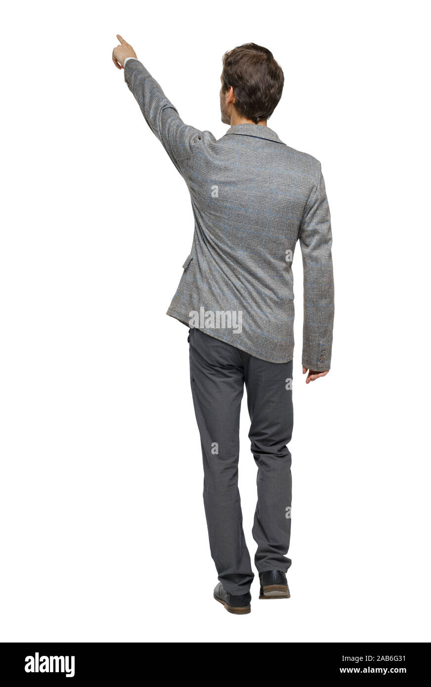Back view of walking pointing business man. gesticulating young guy in ...
