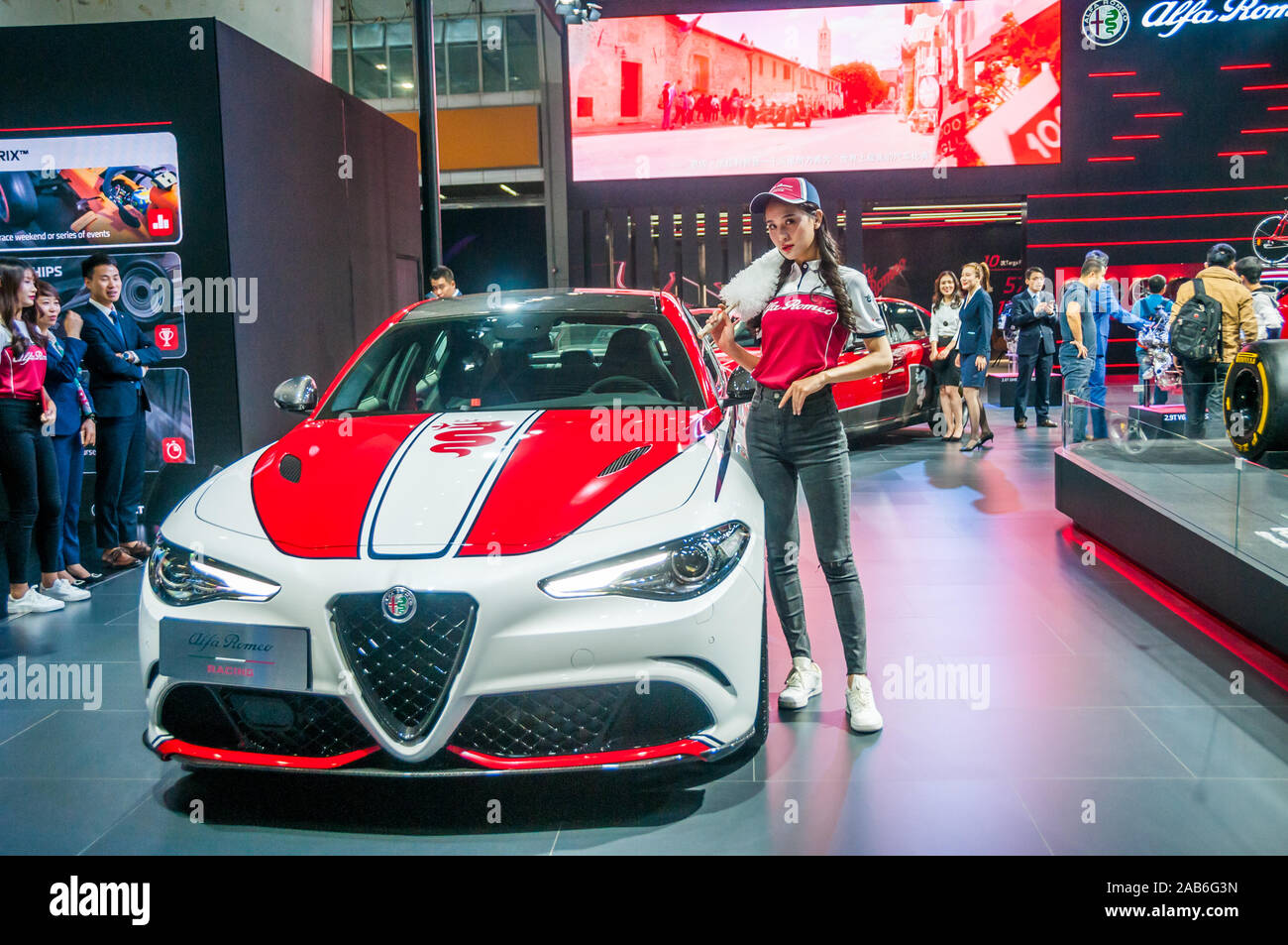 An Alfa Romeo Giulia with cleaning girl race model at the 2019 ...