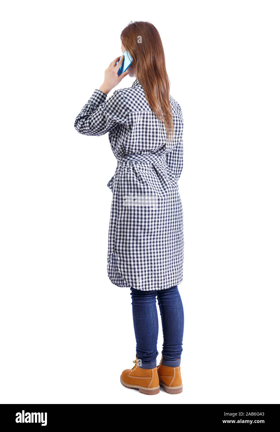 back view of a woman talking on the phone. backside view of person ...