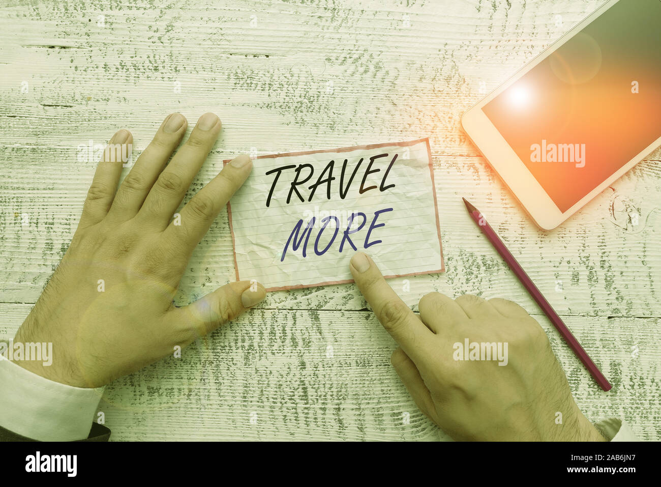 Writing note showing Travel More. Business concept for To make a ...