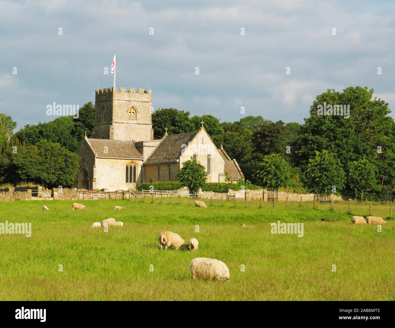 A photography of a field with sheep Stock Photo - Alamy