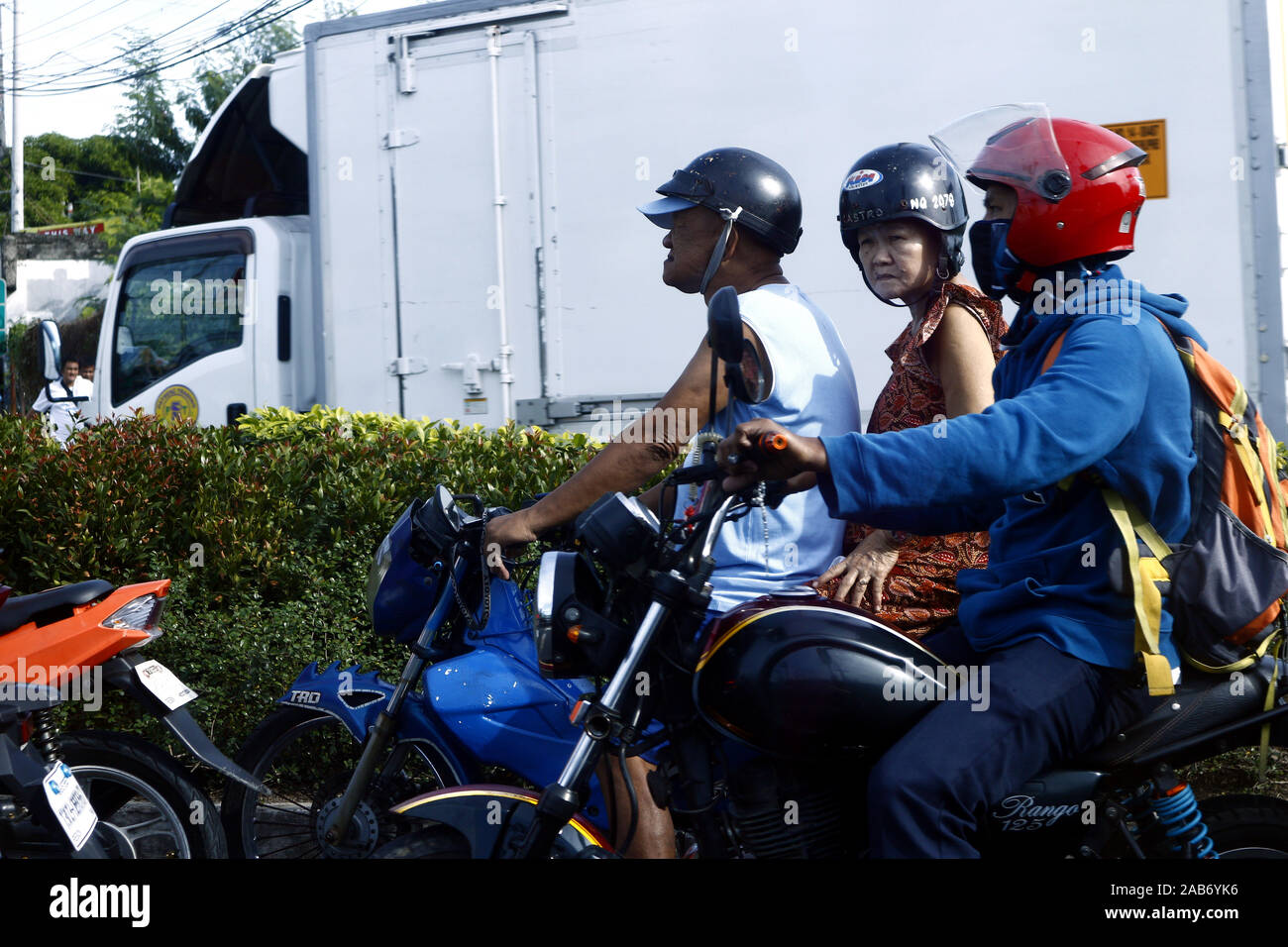 Cainta, Rizal, Philippines - November 24, 2019: Motorcycle riders stop ...