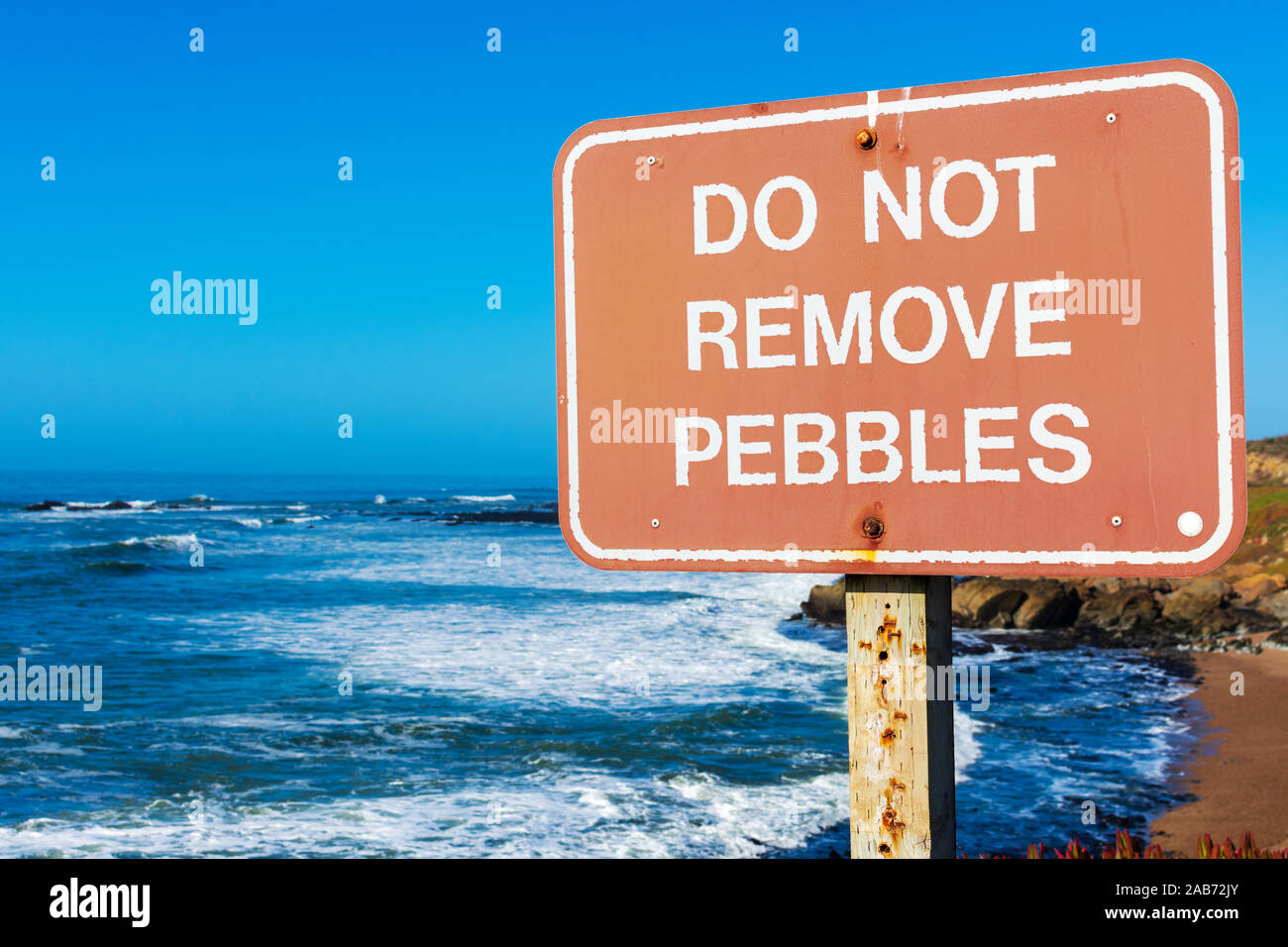 Do not remove pebbles warning sign on the public ocean beach Stock ...