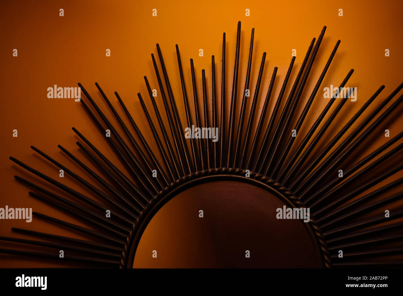 interior wall mirror in the shape of a sun with metal brass sun rays as ...