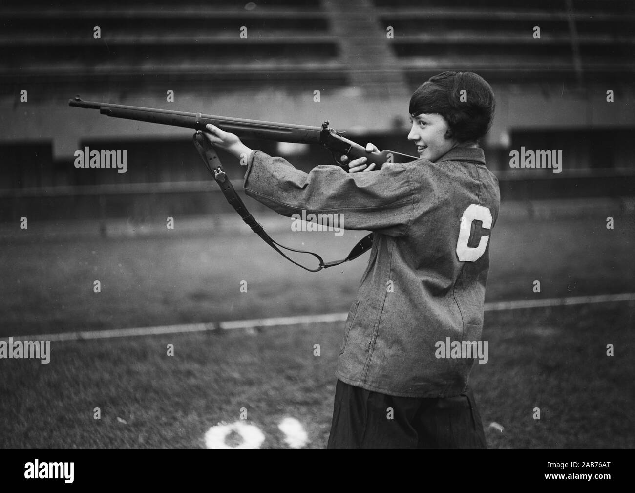 Young woman with rifle ca. 1922 Stock Photo - Alamy