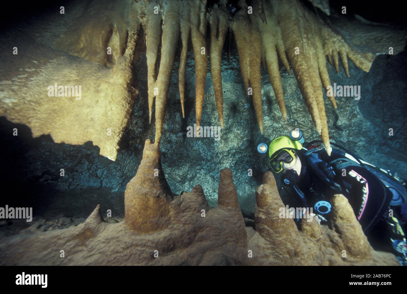 Diver inside a jaws-like formation, the Dragon Tooth Ledge, a line up ...