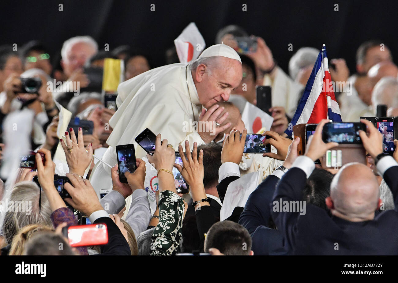Pope Francis kisses a child in Popemobile based by hydrogen fuel cell ...