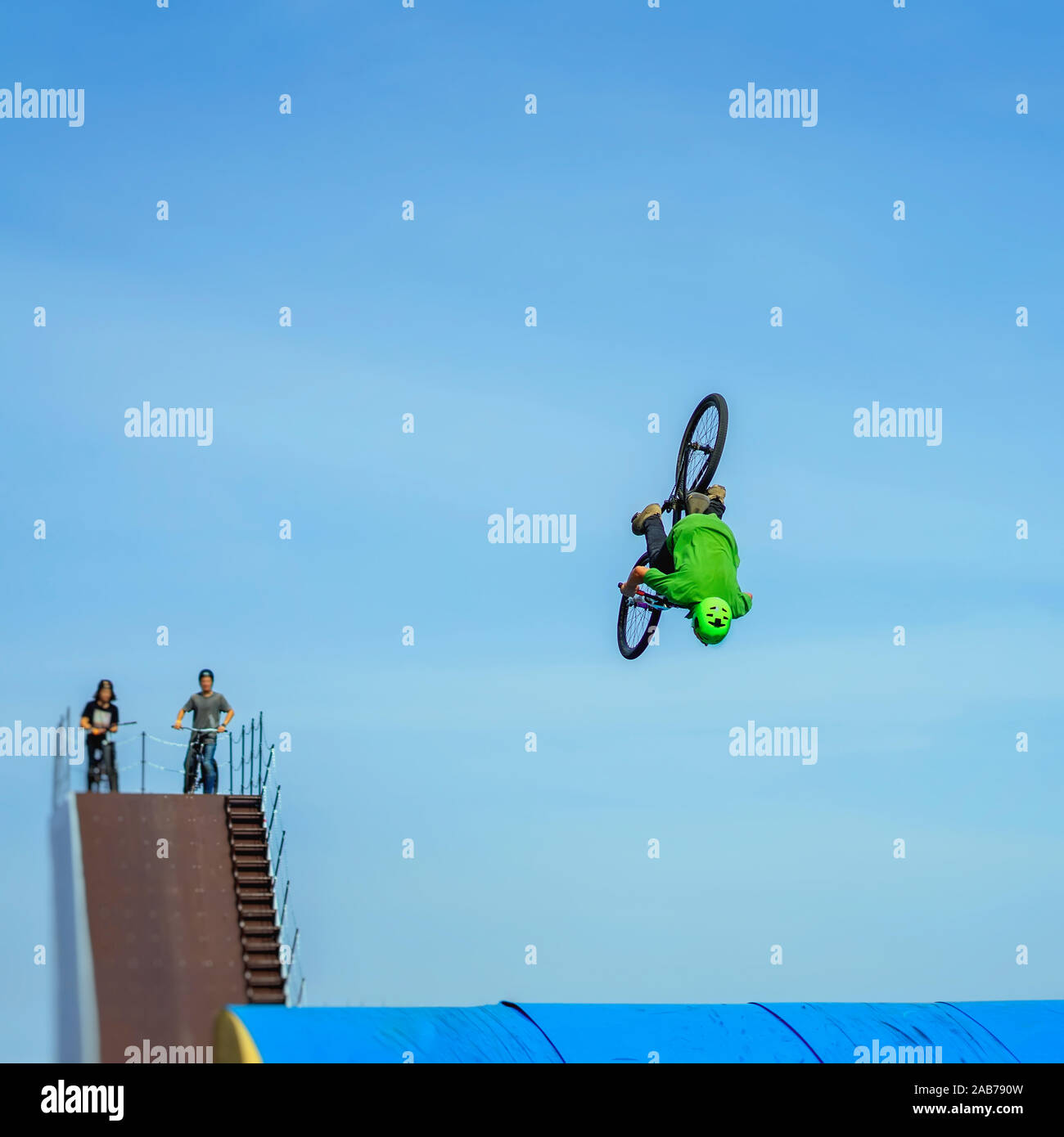 Aerial BMX stunt. Young unrecognizable bike rider performing air trick ...