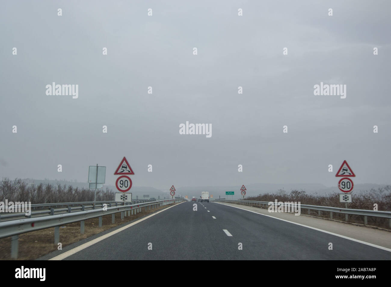 Bulgarian highway with cars and truck, asphalt road with road signs on ...
