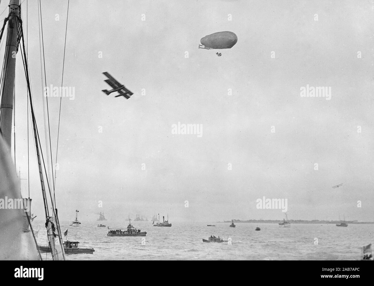 Boats, airplane, and blimp ca. 1921-1923 Stock Photo - Alamy