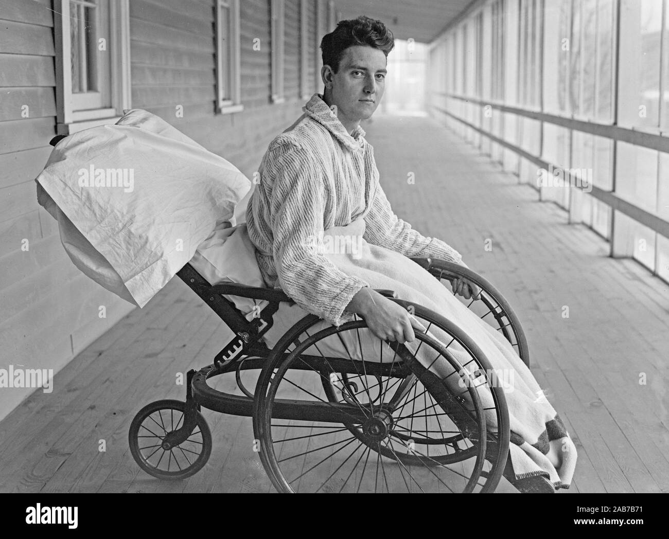 Young veteran soldier in wheelchair on porch, Walter Reed Hospital ...