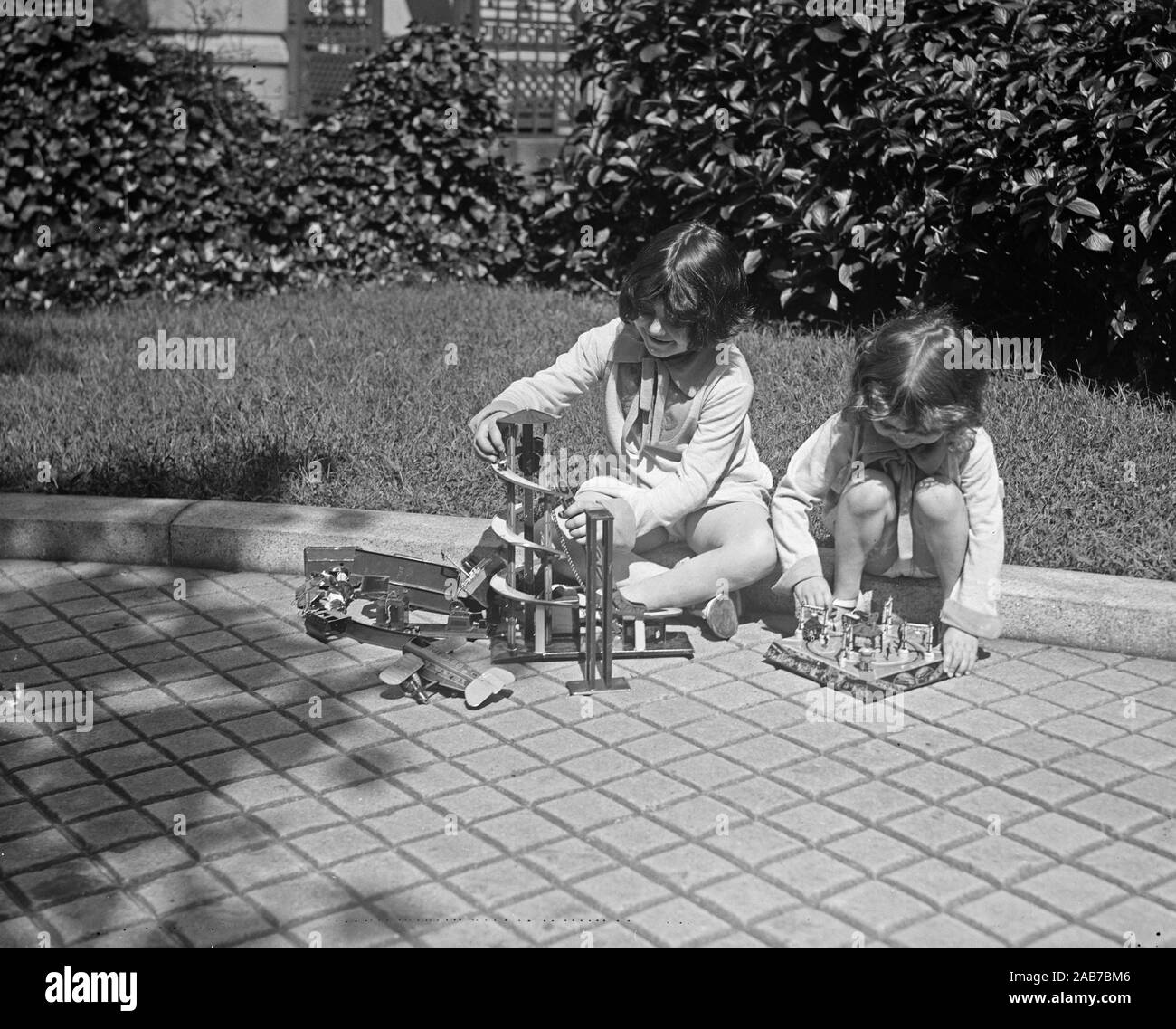 Children playing with toys in the 1920s - ca. 1927 Stock Photo - Alamy