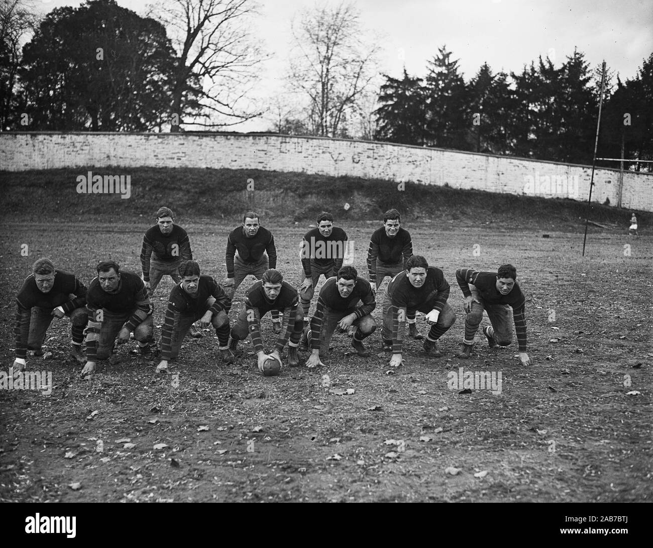 American football players pose for a team photo, taken during the 1920s ...