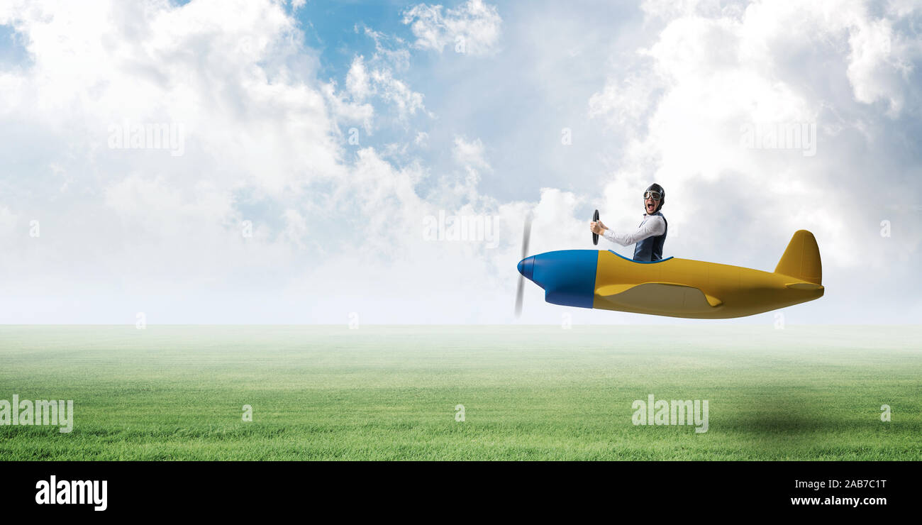 Happy aviator driving small propeller plane Stock Photo - Alamy