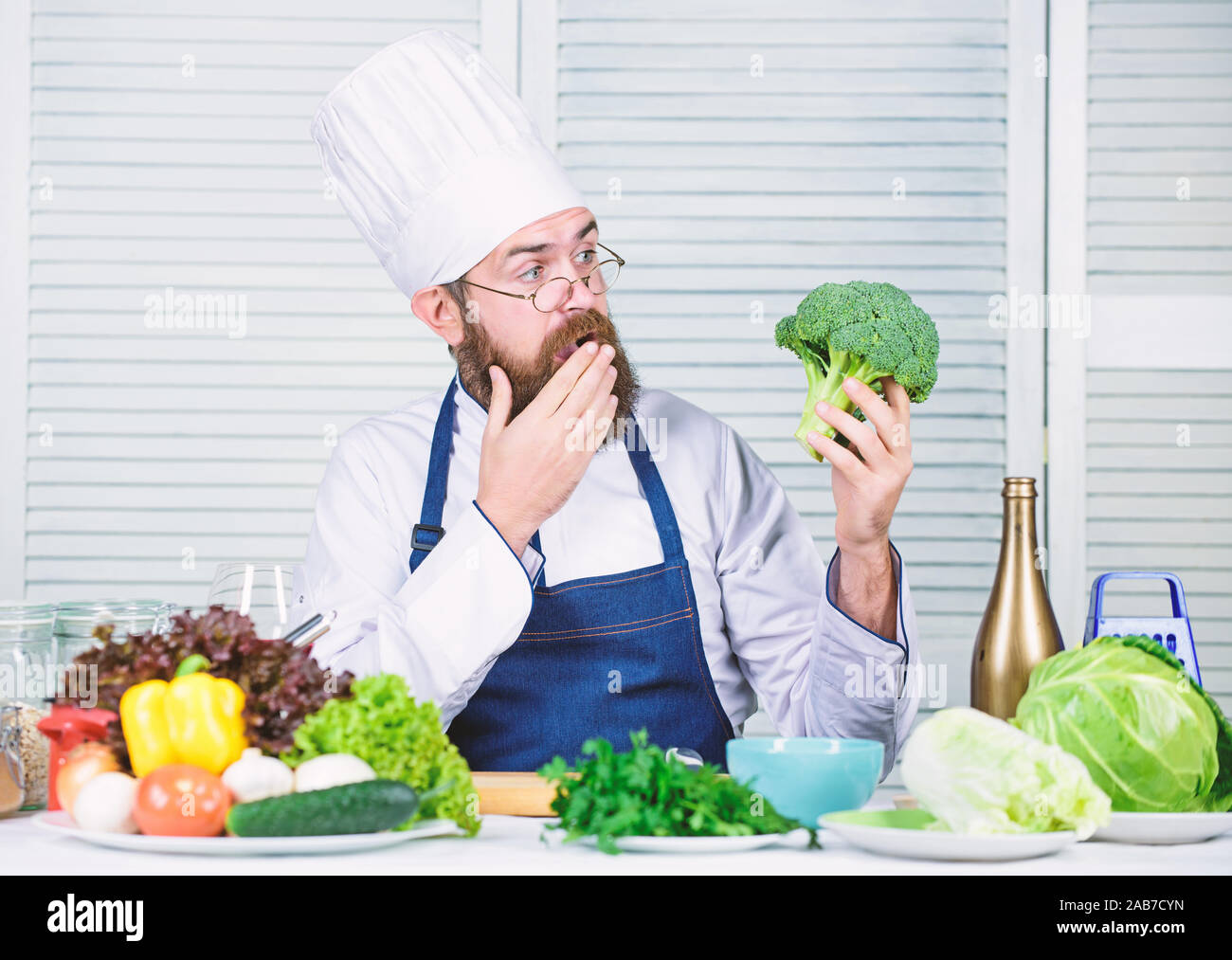 Bearded professional chef cooking healthy food. Healthy vegetarian ...