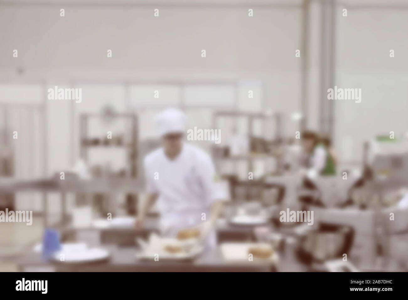 Chef cooking in restaurant kitchen blurred defocused background Stock ...