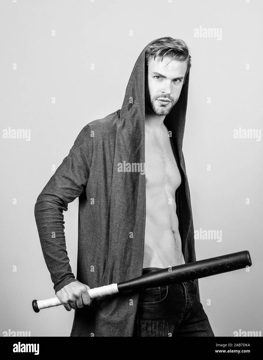Sportsman strong looks threatening with bat. Aggression masculinity ...