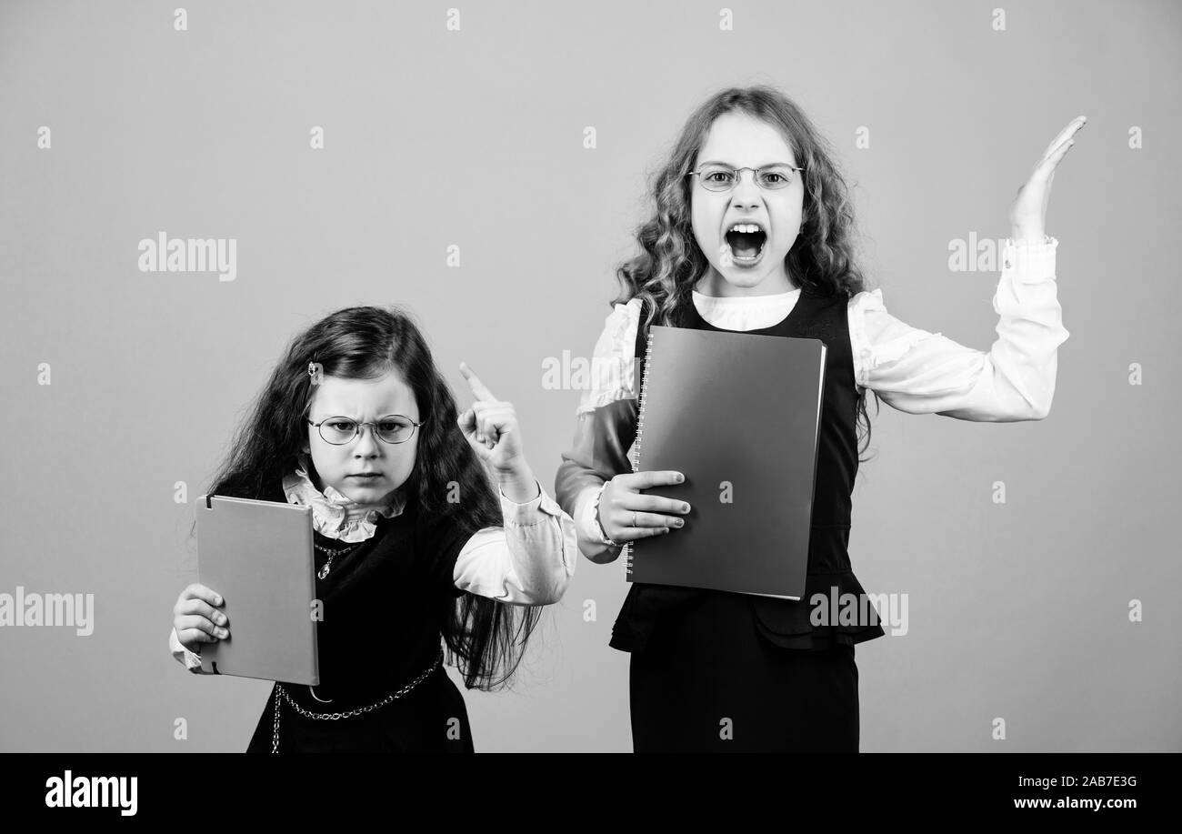 best friends since school. hometwork together. notebook for diary notes ...