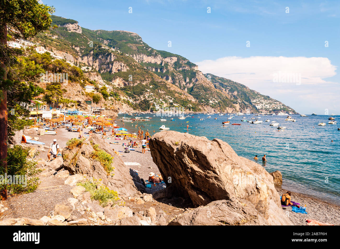 Positano, Italy - September 05, 2019: Big boulders lying on the beach ...