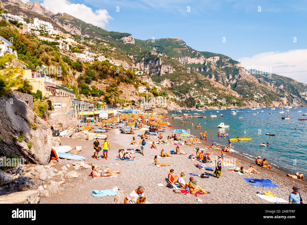 Positano, Italy - September 05, 2019: People resting, sunbathing and ...