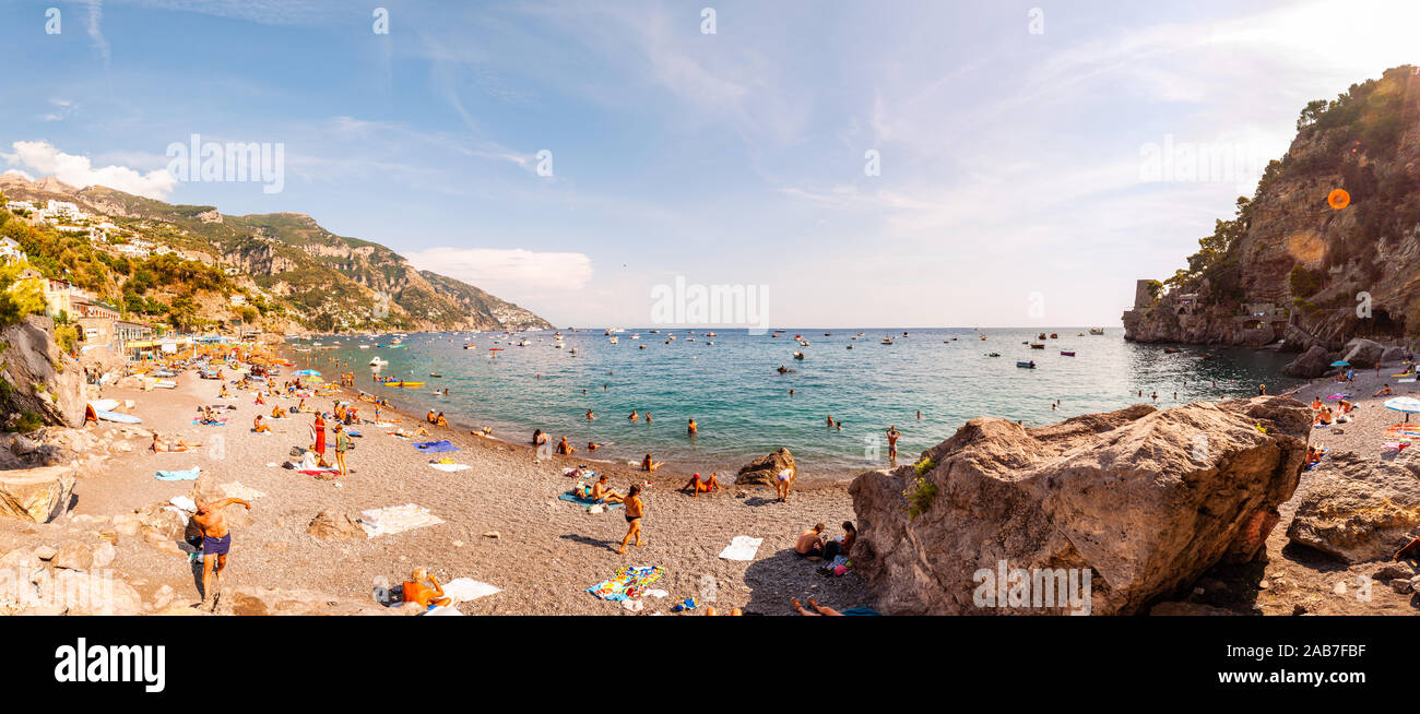 Positano, Italy - September 05, 2019: People resting, sunbathing and ...