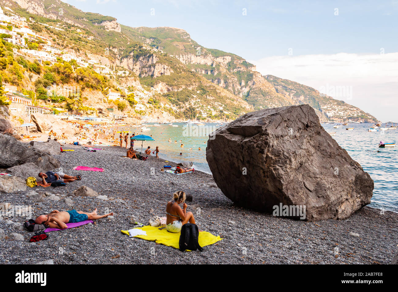 Positano, Italy - September 05, 2019: Big boulders lying on the beach ...