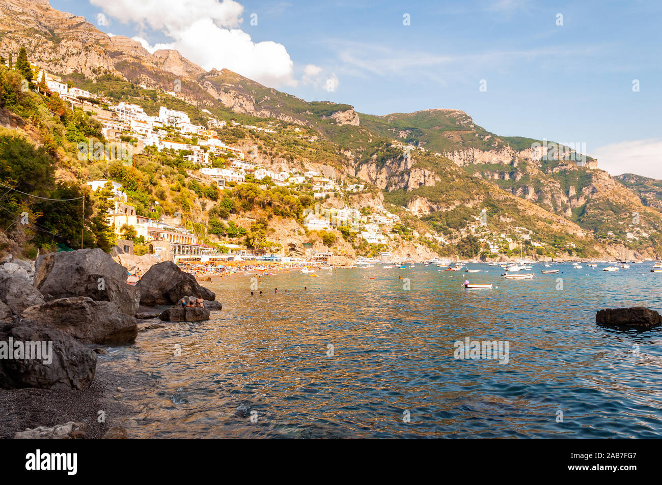 Positano, Italy - September 05, 2019: Big boulders lying on the beach ...