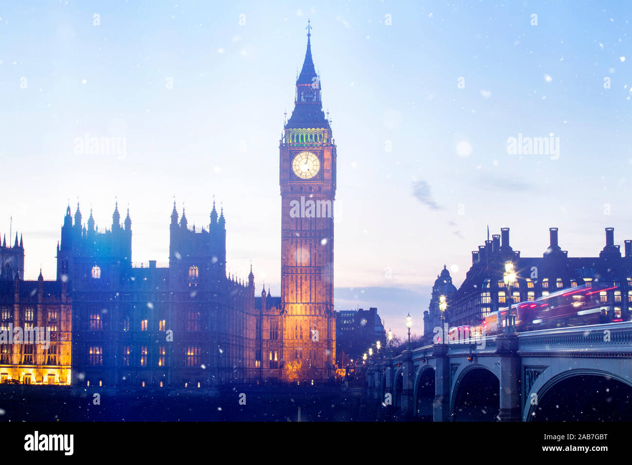 Big Ben and Westminster on a cold winter night with falling snow ...