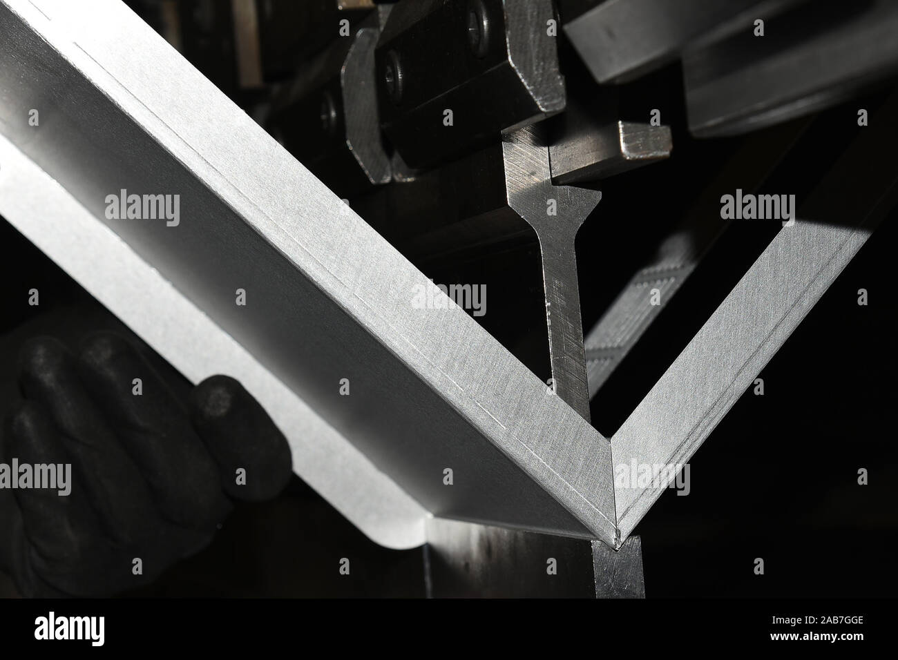 operator bending metal sheet by sheet bending machine bending of metal ...