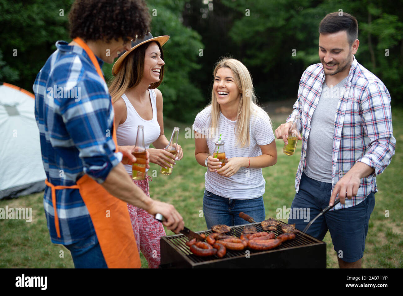 Group friends doing bbq in hi-res stock photography and images - Alamy
